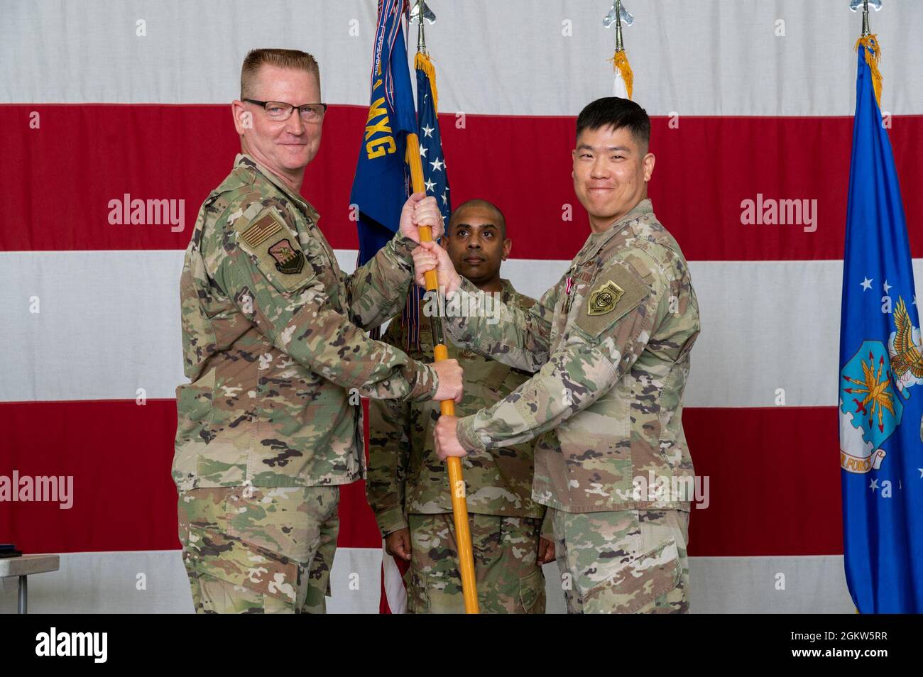 Col. Brian Moore, 51st Maintenance Group commander, left, receives the ...