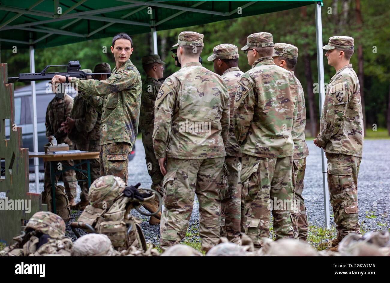 German Army Staff Sgt. Thomas Eck, left, a range control safety officer ...