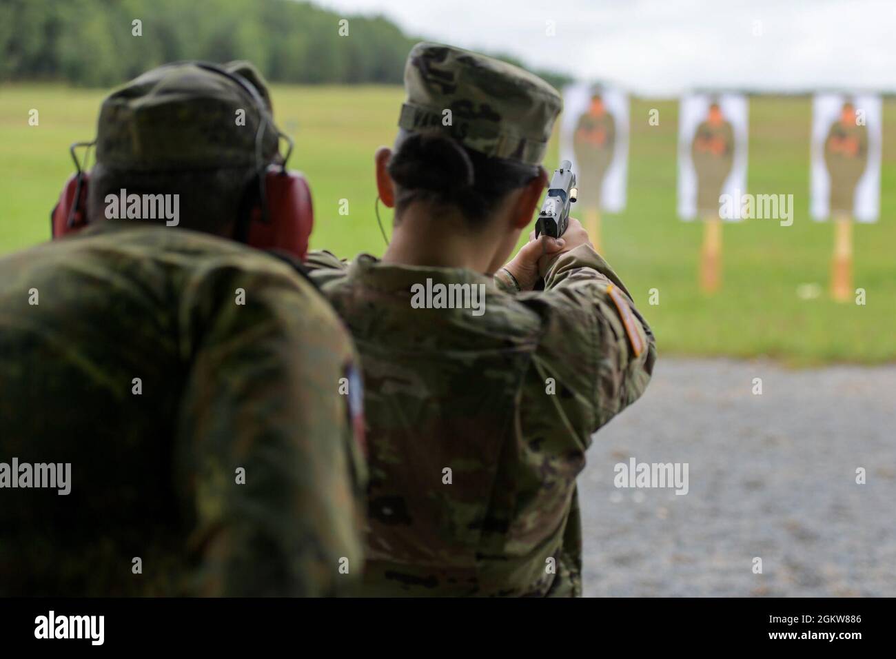 U.S. Army Pfc. Celismari Vargas, right, assigned to 7th Army Training ...