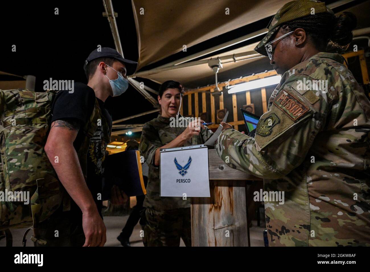 U.S. Air Force Tech Sgt. Ronda Esker, center, the Personnel Support for ...