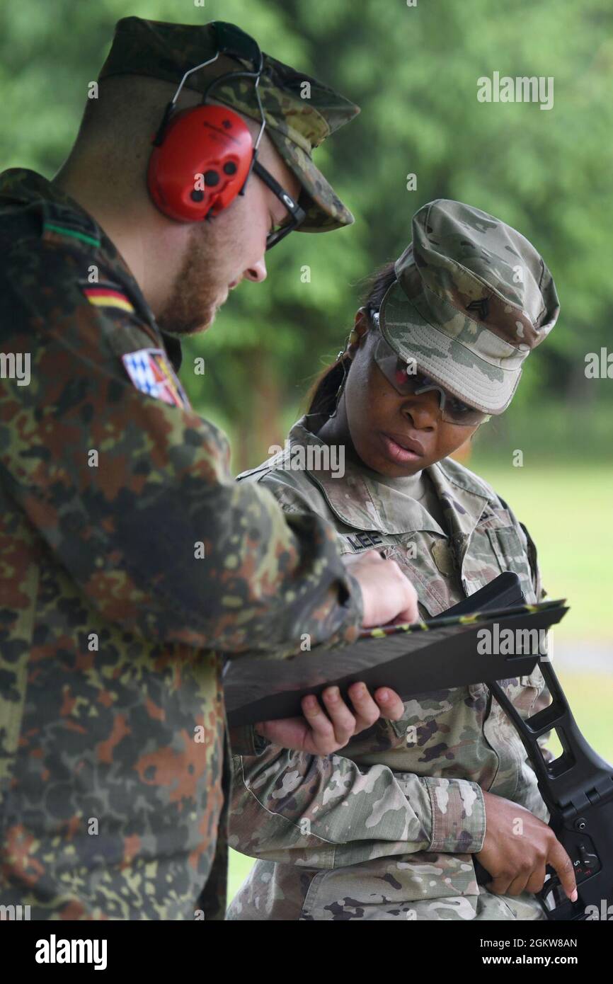 A German soldier, left, briefs U.S. Army Sgt. Keeiaru Lee with 7th Army ...
