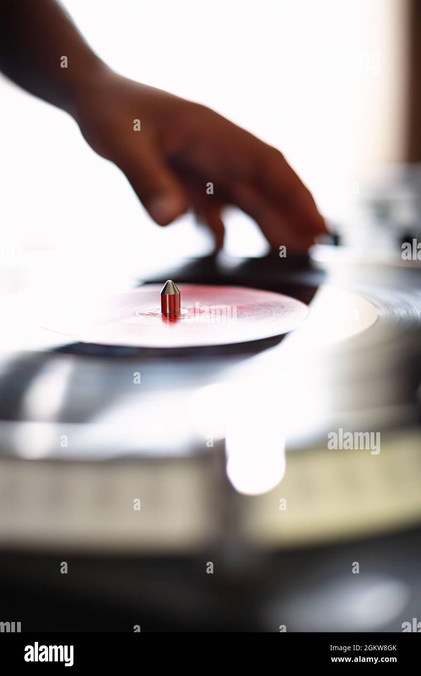 Turntable and dj hand on background. Disc jockey turn table player ...