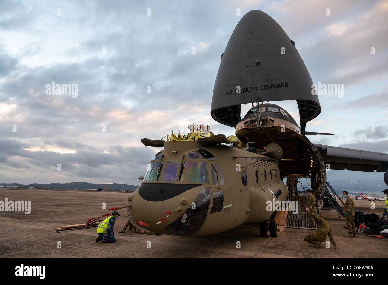 A CH-47F Chinook helicopter is unloaded from a Dover Air Force Base C ...