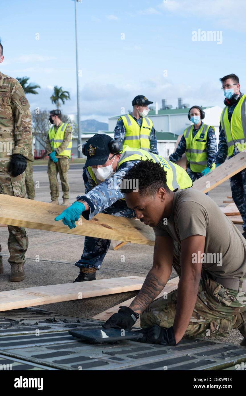 U.S. Air Force Staff Sgt. Gregory McBride, right, 9th Airlift Squadron ...