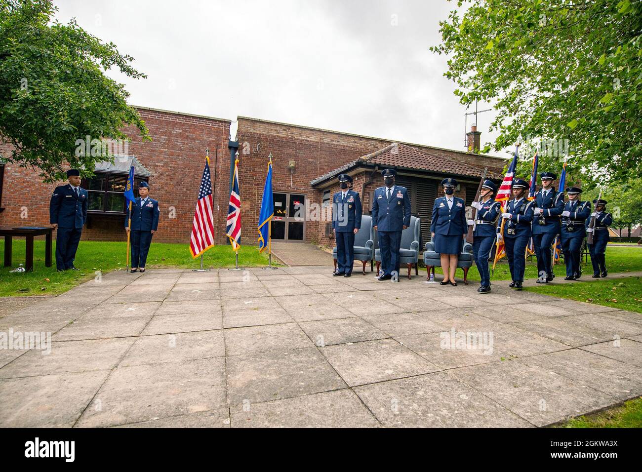 The 423rd Air Base Group base honor guard, right, presents the colors during a change of command ...