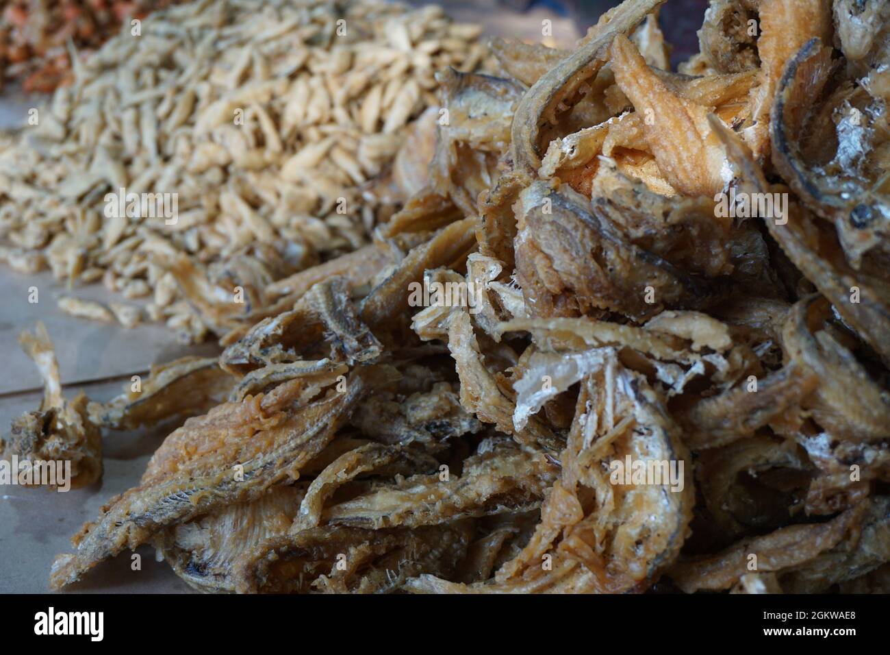 Fried fish with a natural background. Indonesian fried fish covered ...