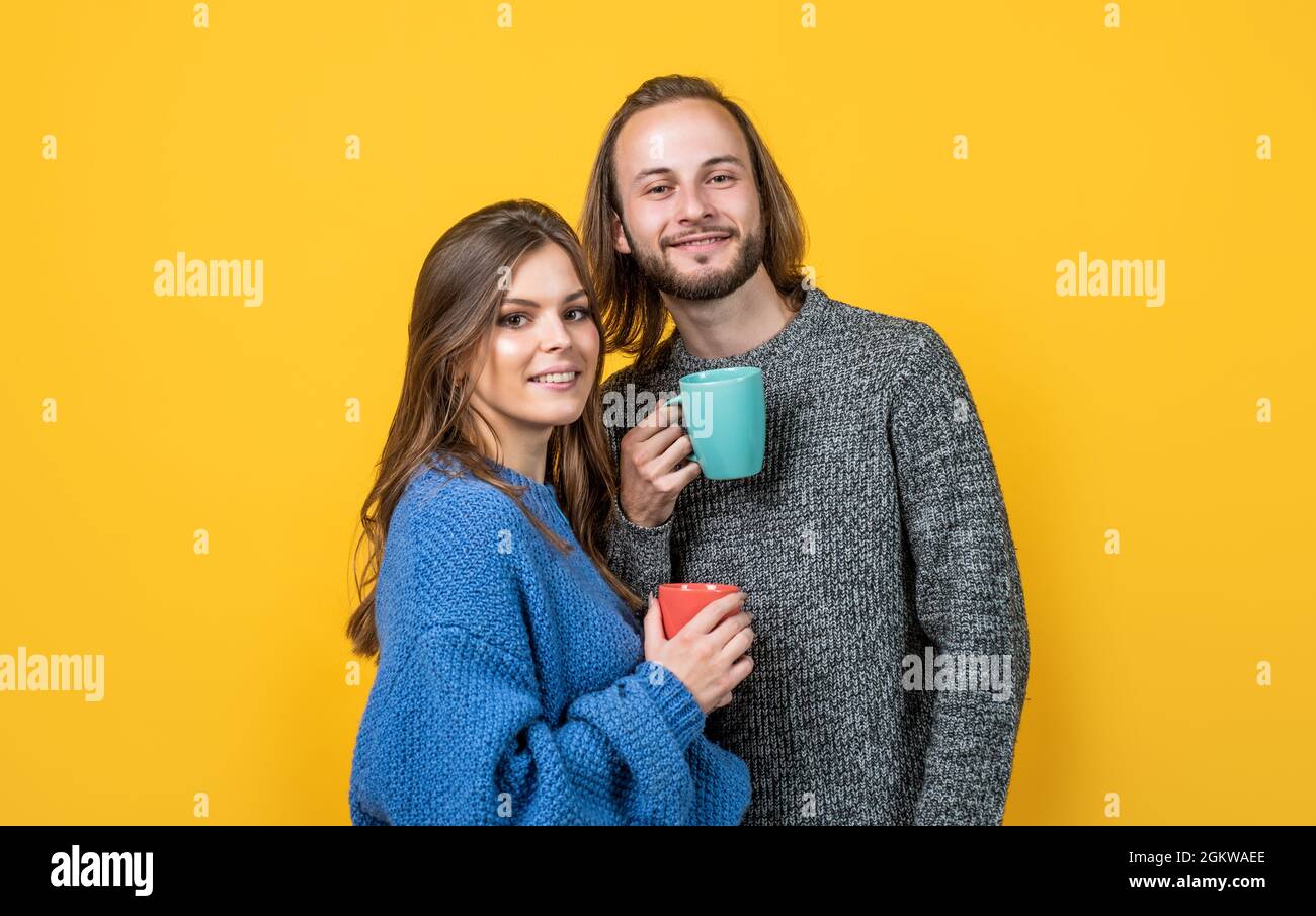 happy couple in love drink hot coffee wear knitted clothes in winter ...