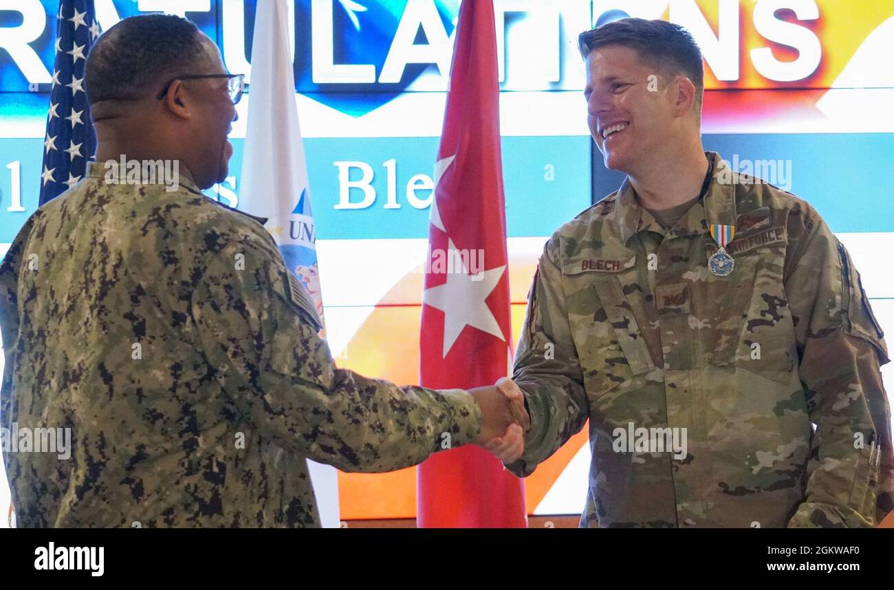 U.S. Navy Fleet Master Chief Donald Myrick congratulates U.S. Air Force ...