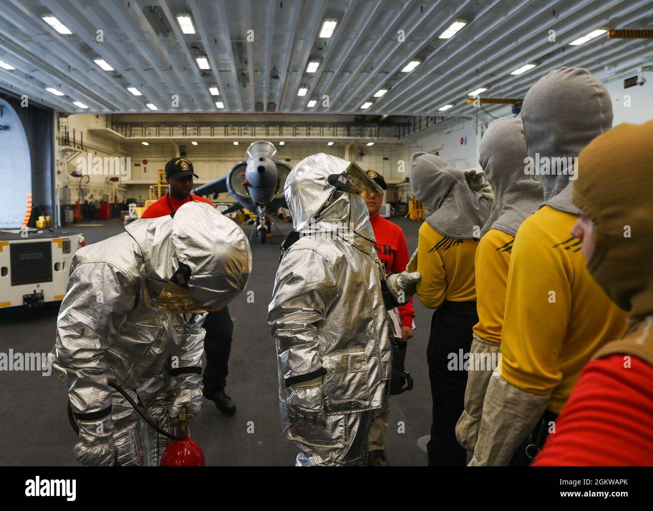 210708-N-NM271-1001 PACIFIC OCEAN (July 8, 2021) – Sailors participate in an aircraft fire ...