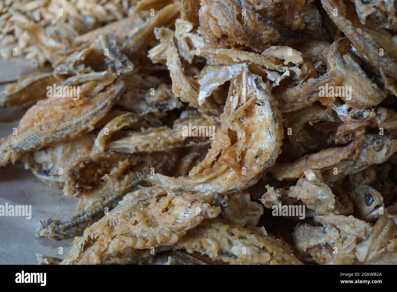Fried fish with a natural background. Indonesian fried fish covered ...