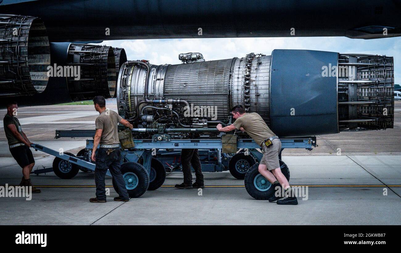 Airmen from Dyess Air Force Base, Texas, remove a F-101 engine from a B ...