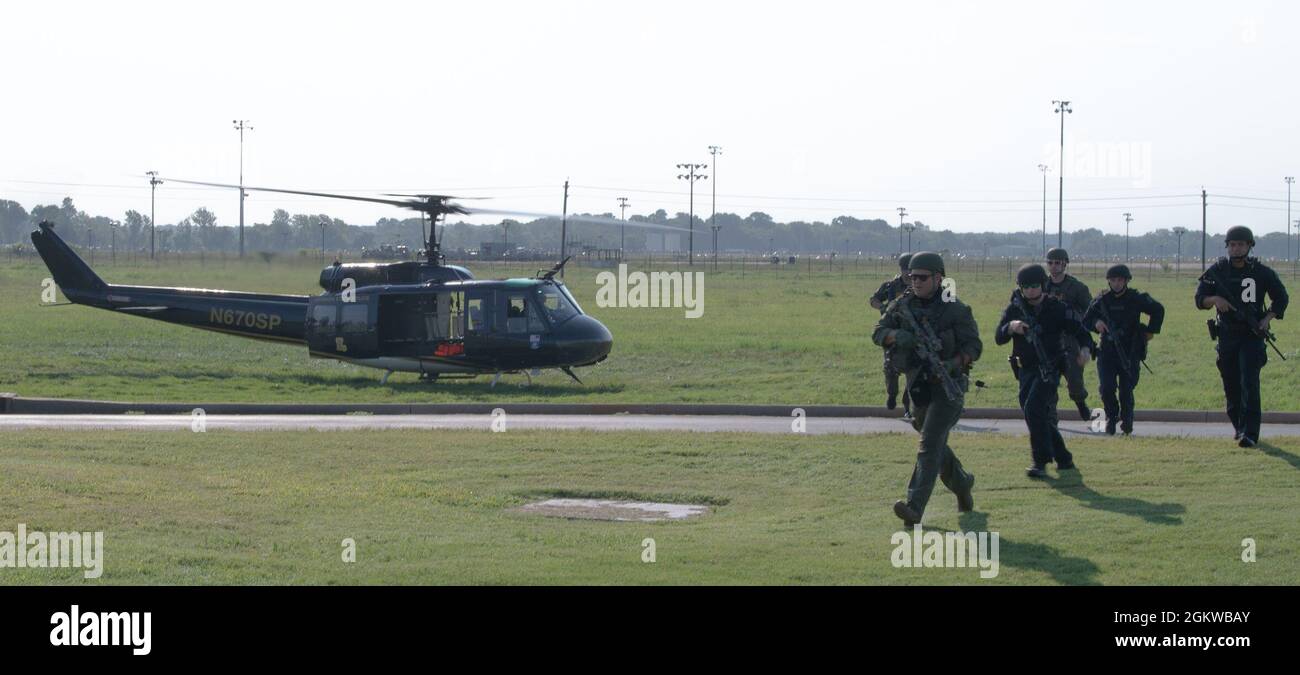 The Louisiana State Police fly in on a helicopter to participate in a ...