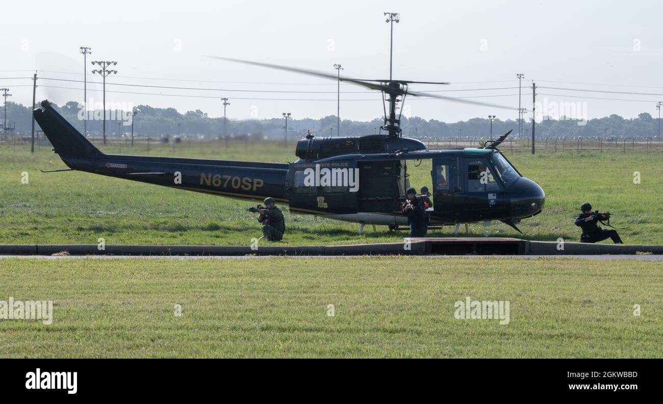 The Louisiana State Police fly in on a helicopter to participate in a ...
