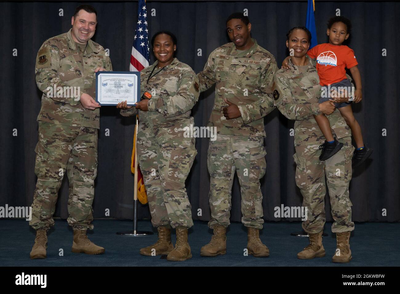 Staff Sgt. Raven McGee, 2nd Bomb Wing technical sergeant selectee, receives a certificate for ...