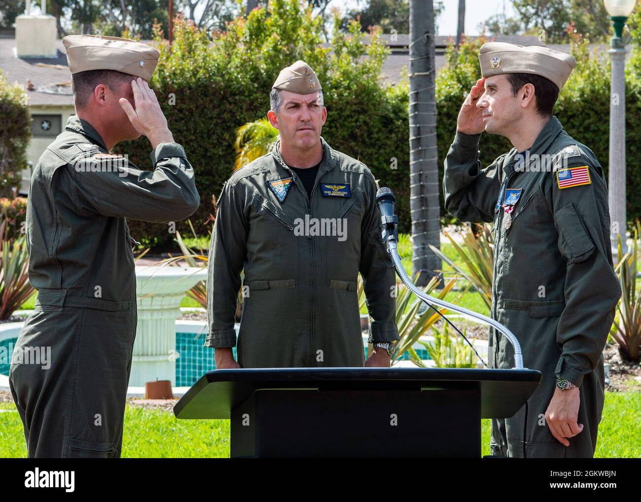 SAN DIEGO (July 8, 2021) Cmdr. Kyle McDaniel, left, salutes Cmdr ...