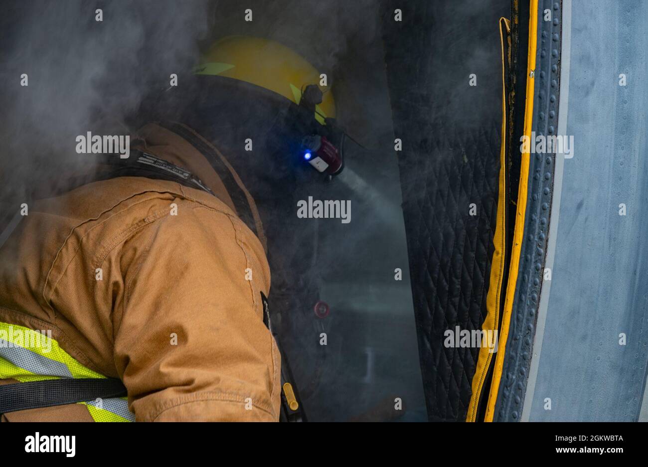 A 152nd Civil Engineer Squadron fire protection specialist enters a ...