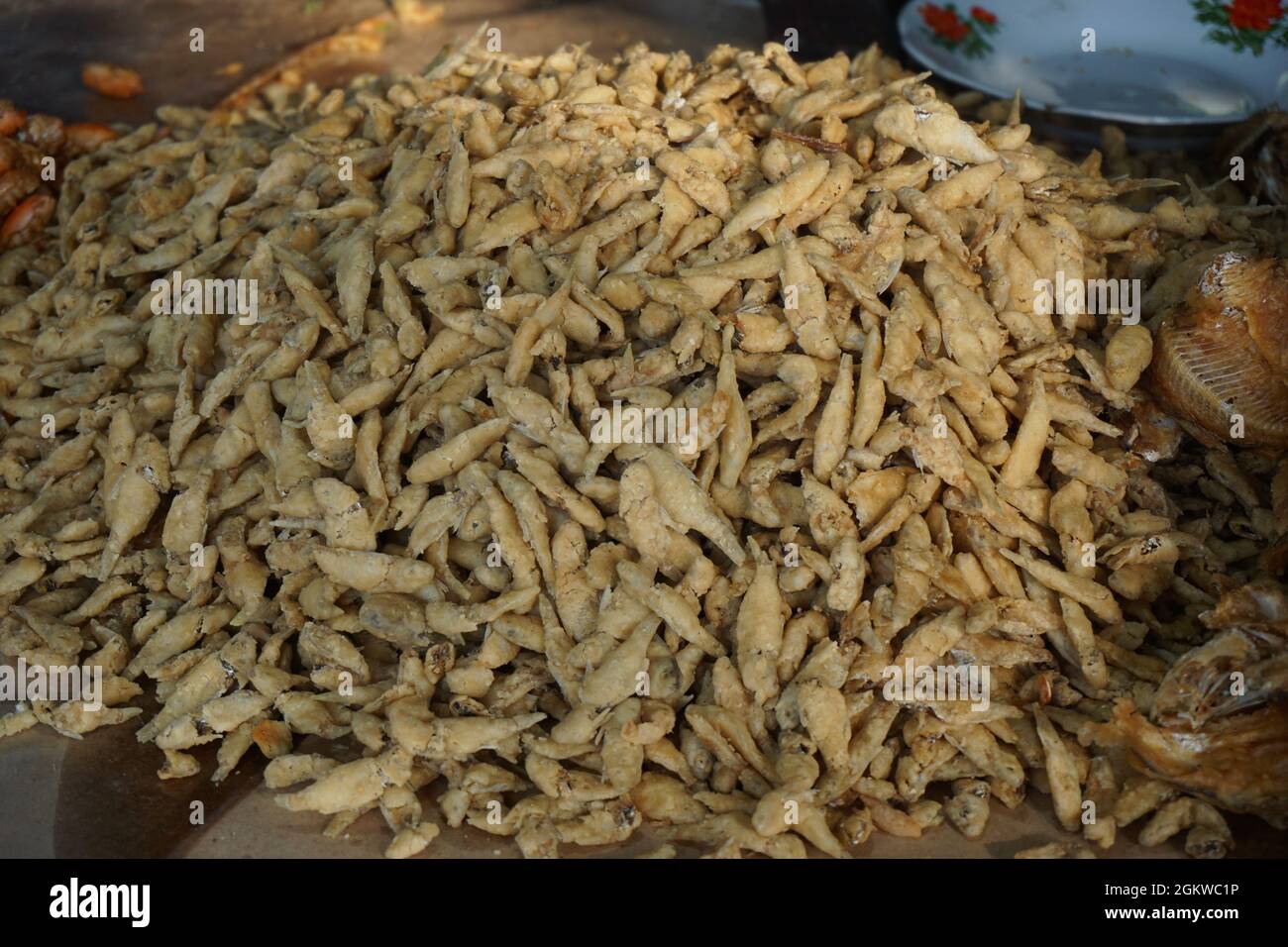 Fried fish with a natural background. Indonesian fried fish covered ...
