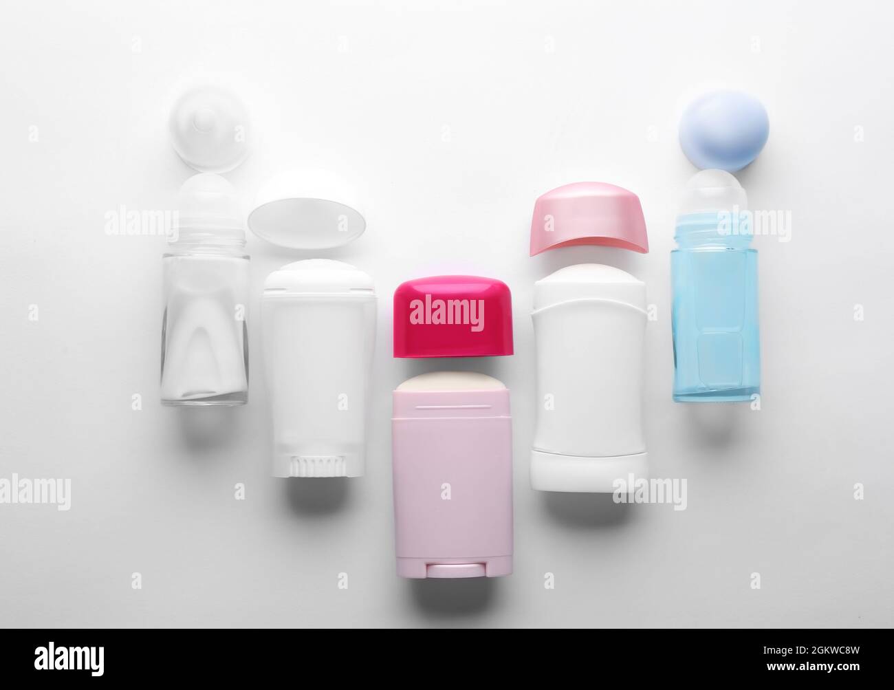 Various deodorants for women on white background Stock Photo - Alamy