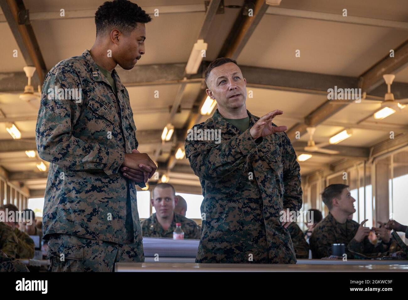 U.S. Marine Corps Capt. Owen Tucker, left, an intelligence officer with ...