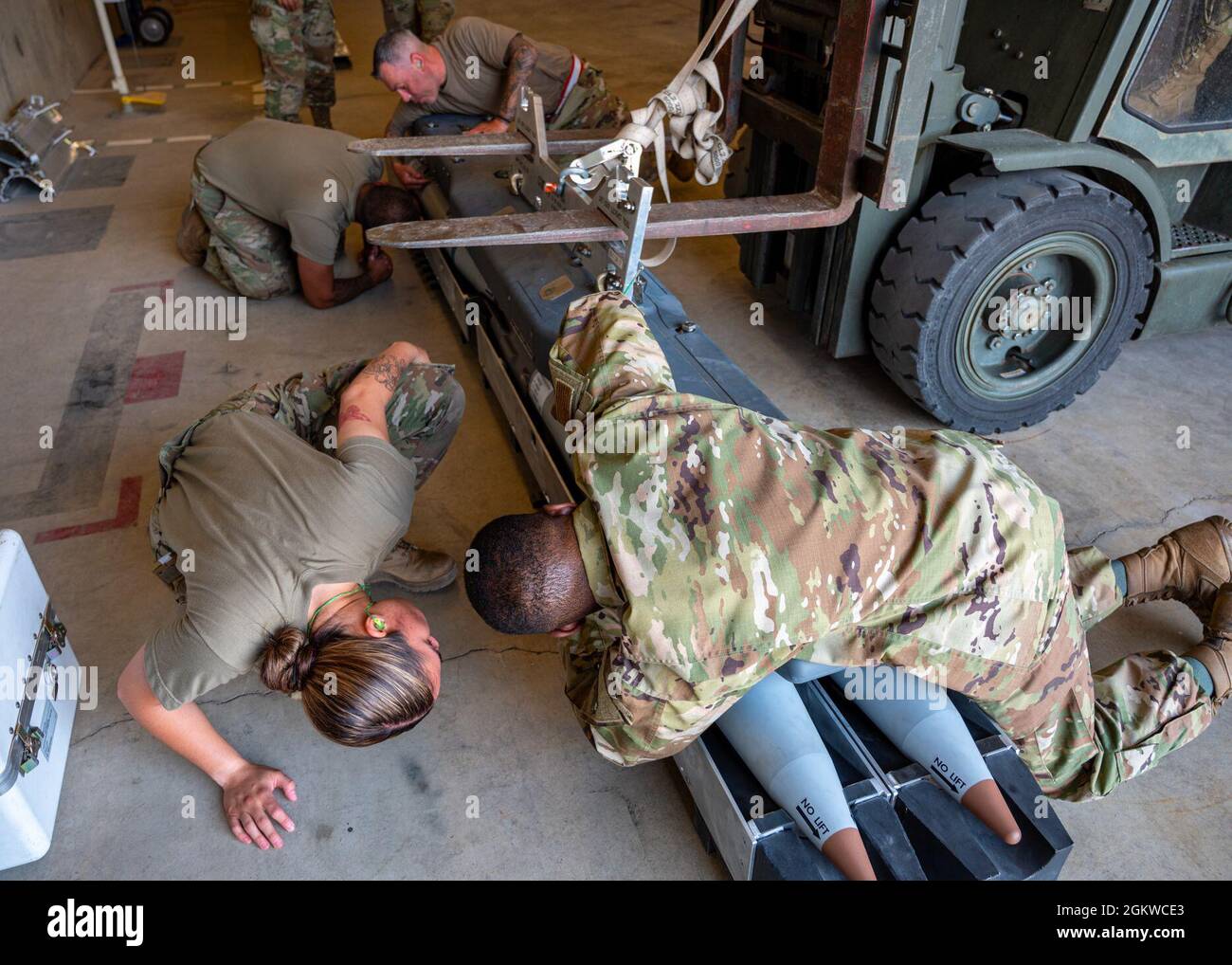 U.S. Air Force Airmen assigned to the 388th munitions squadron, secure ...