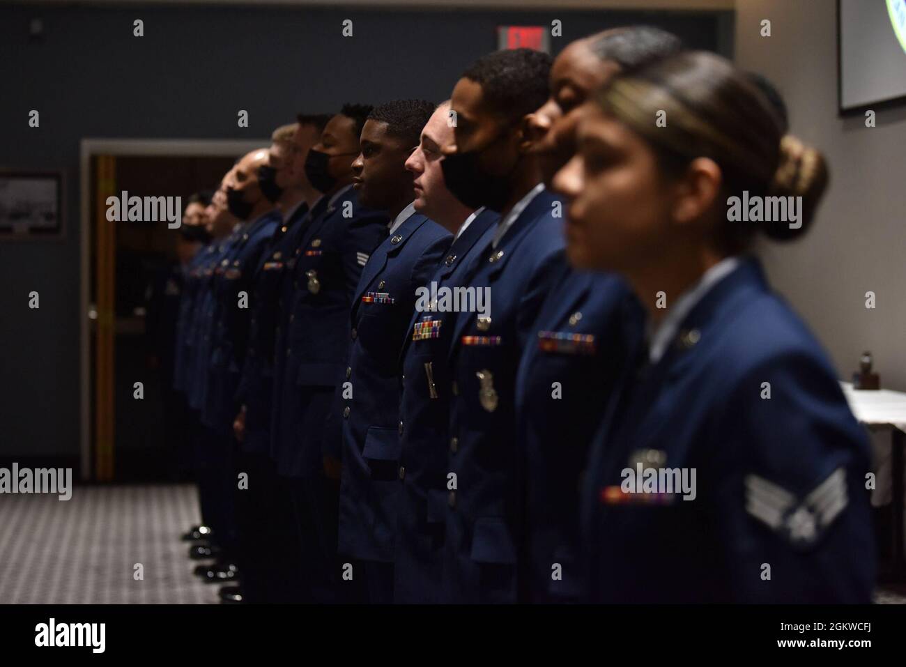 Airman Leadership School, Class 21-E graduates, line up to sing the Air ...