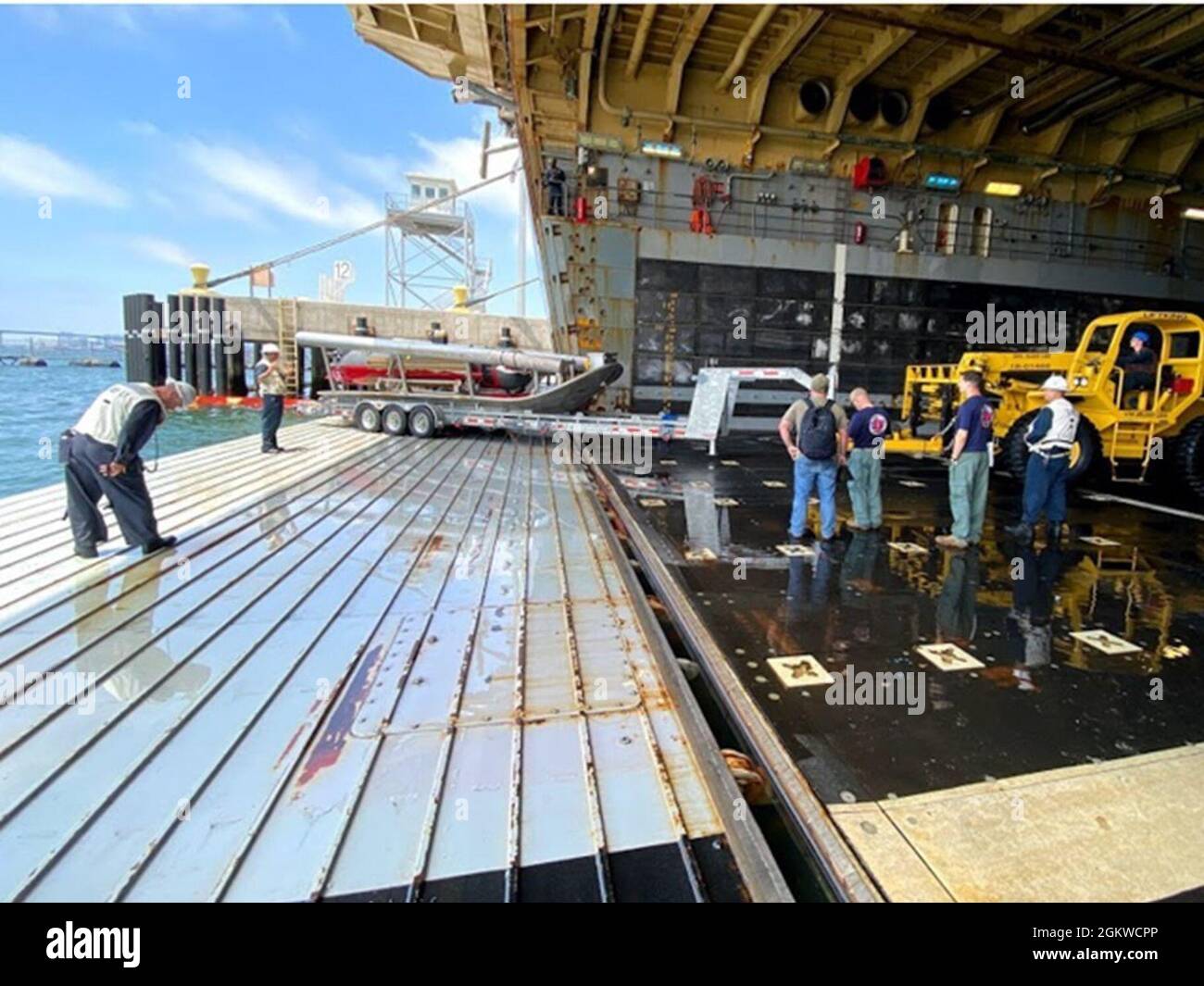 Crew readies the UUV, Sled, Trailer for Disembark via Crane lift from ...