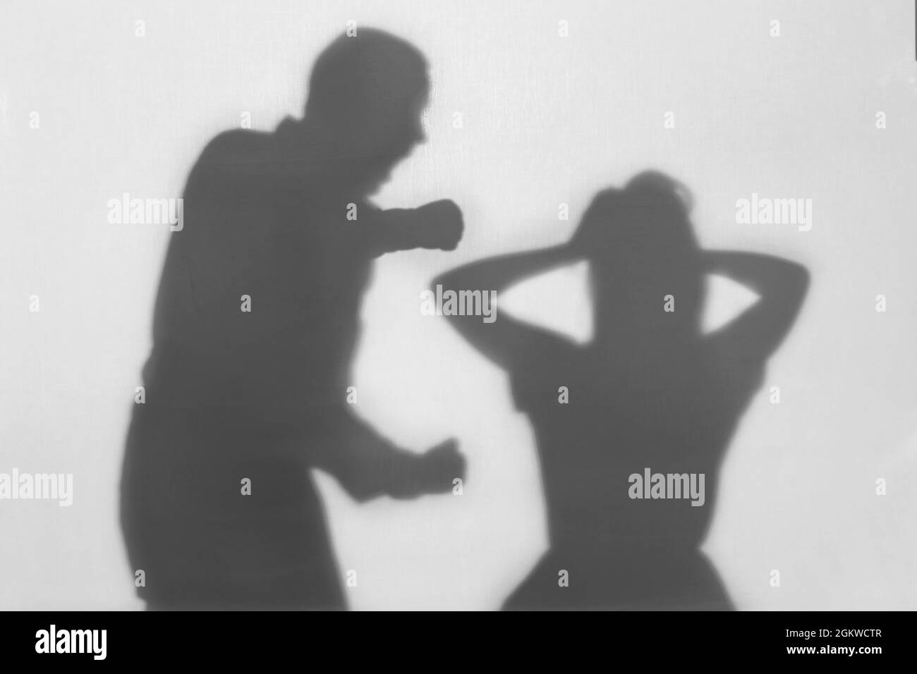 Silhouette of man hurting his wife on white background. Domestic ...