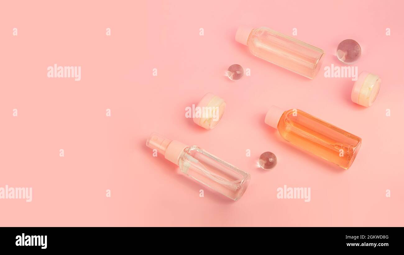 Group of cosmetics bottles with cream and liquid products. Travel kit ...