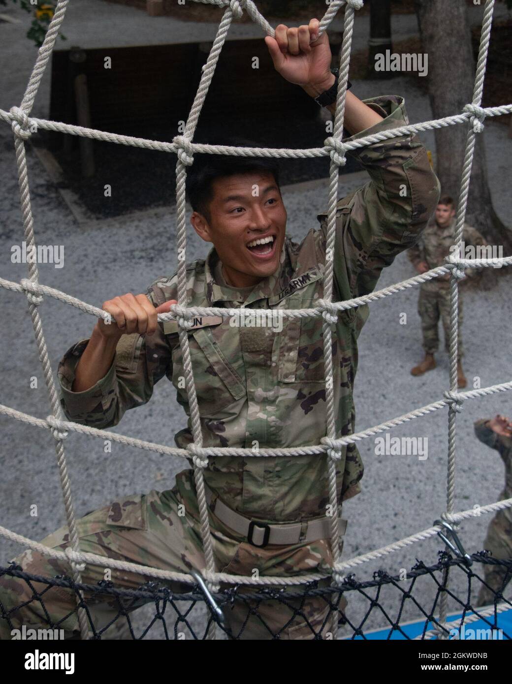A Cadet of 7th Regiment, Advanced Camp descends the rope ladder on the ...