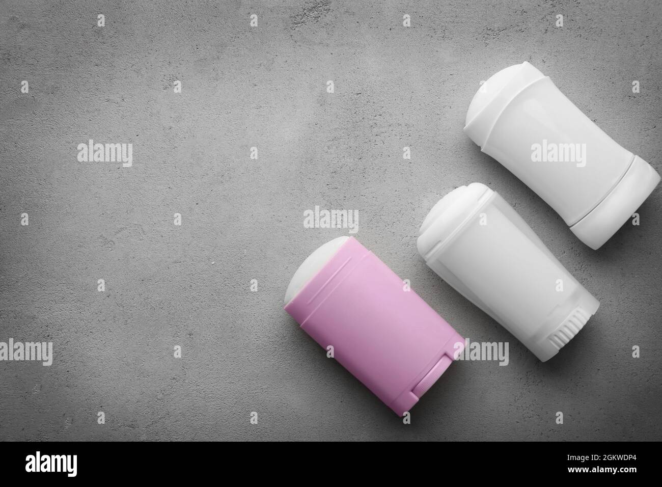 Solid deodorants for women on grey background Stock Photo - Alamy