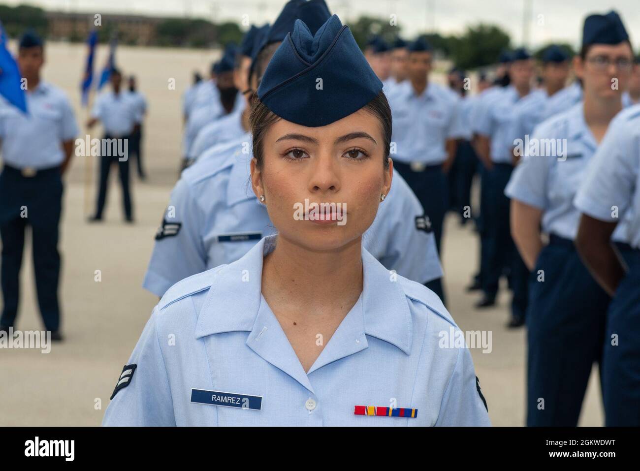 U.S. Air Force Airmen and Space Force Guardians basic military graduation and coining ceremony ...