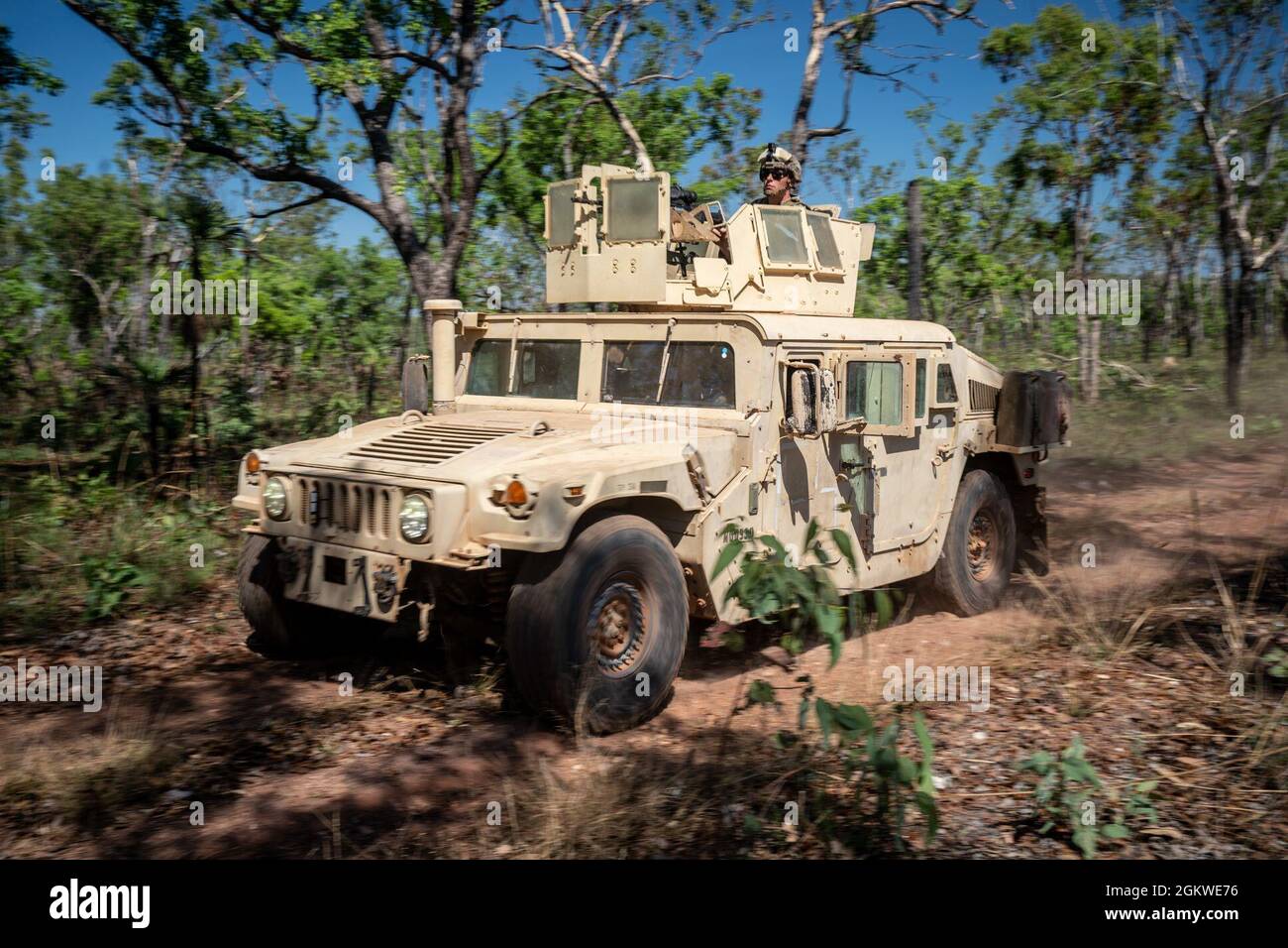 U.S. Marines in a Humvee drive to a range to begin live-fire training ...