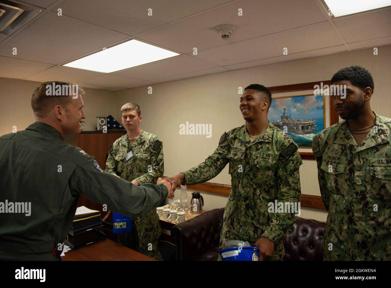 U.S. Navy Capt. Cassidy Norman, left, commanding officer of the ...