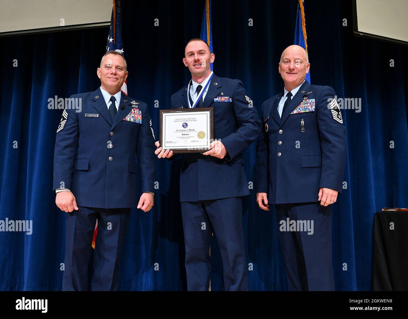 U.S. Air Force Senior Airman Lucas Martin receives the Distinguished ...