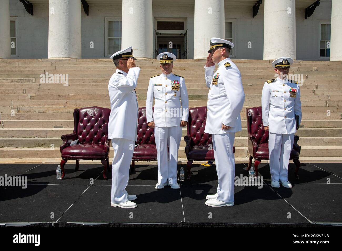 PORTSMOUTH, Va. (July 9, 2021) – Capt. Robert Hawkins, left, exchanges ...