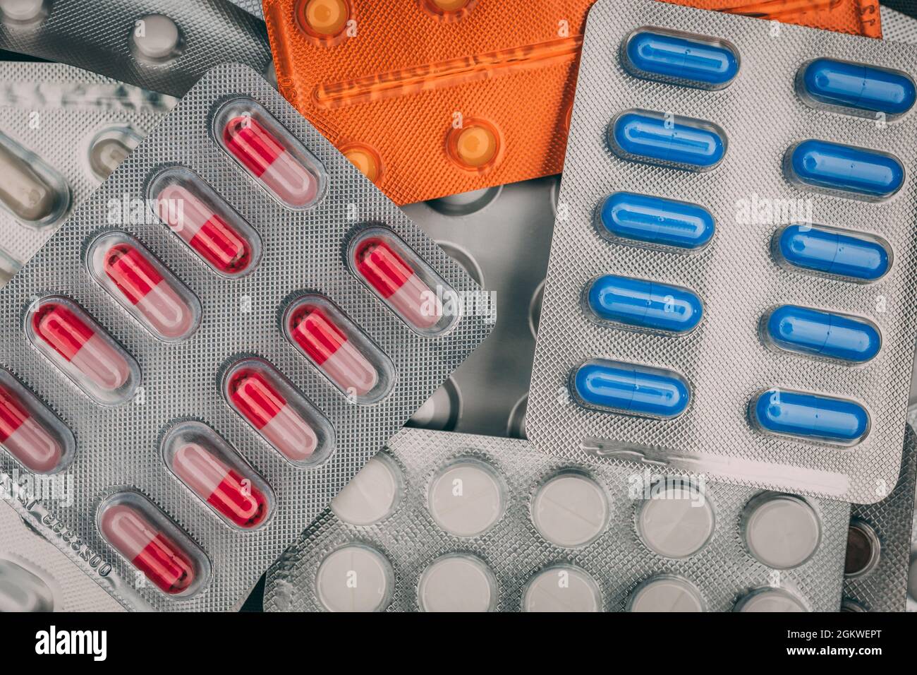 Top view of many blister packs with different pills on the table Stock ...