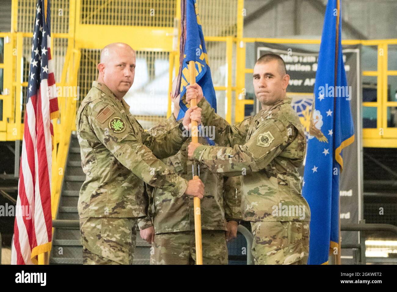 Col. Bary Flack, left, 436th Maintenance Group commander, passes the ...