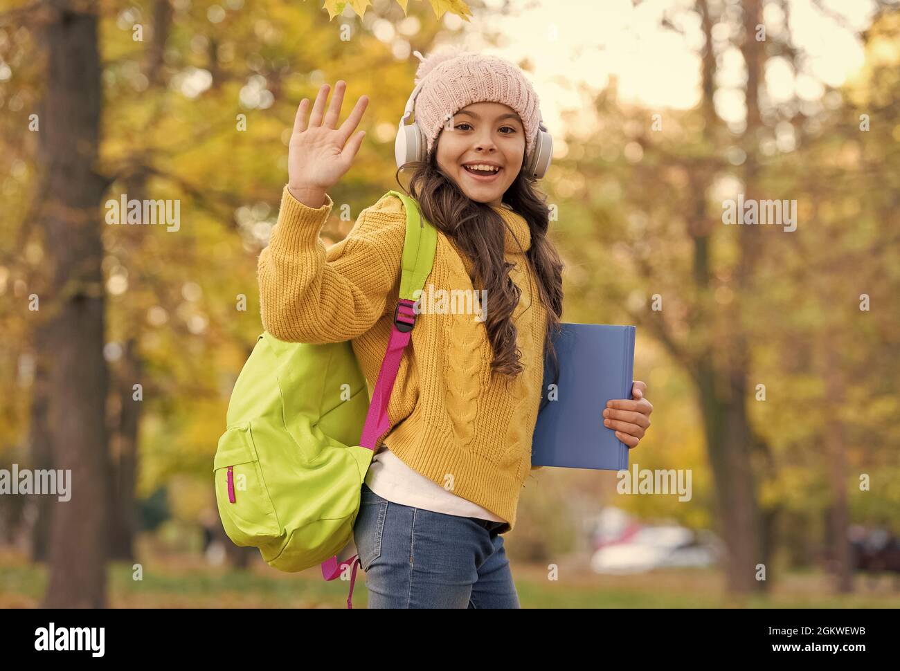 Enjoying the day. small girl wear headphones. back to school. modern ...