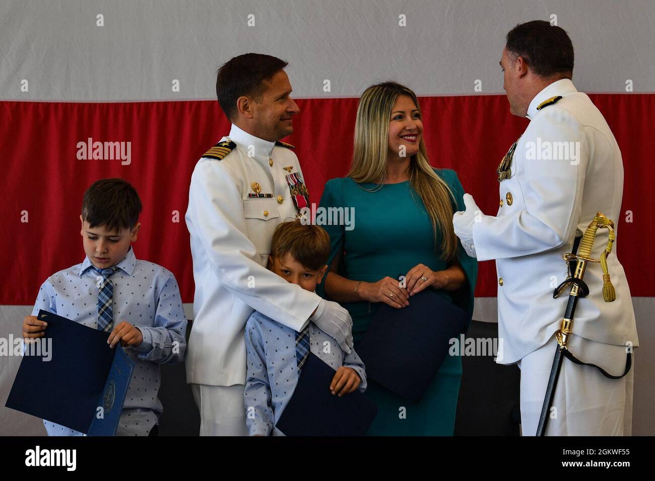 Rear Adm. Brad Collins, Commander Navy Region Northwest, presents ...