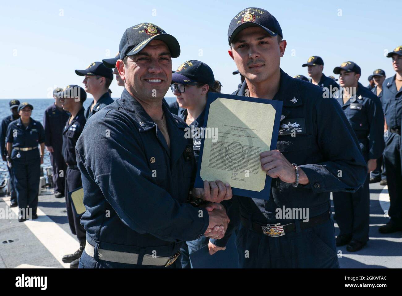 BLACK SEA (July 9, 2021) Commanding Officer Cmdr. John D. John, left ...