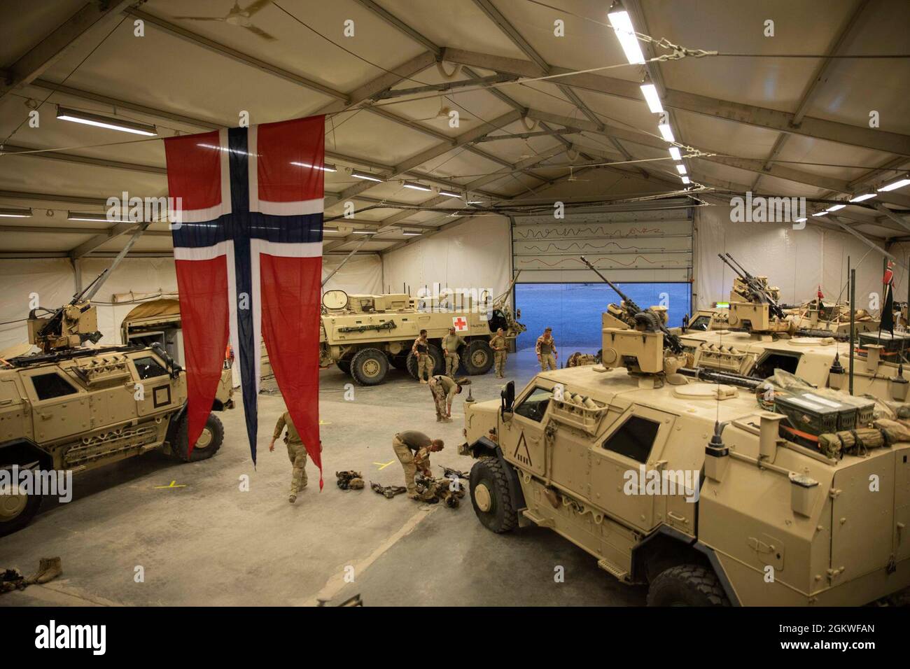 A Norwegian Soldiers from Task Force Viking, runs equipment checks ...