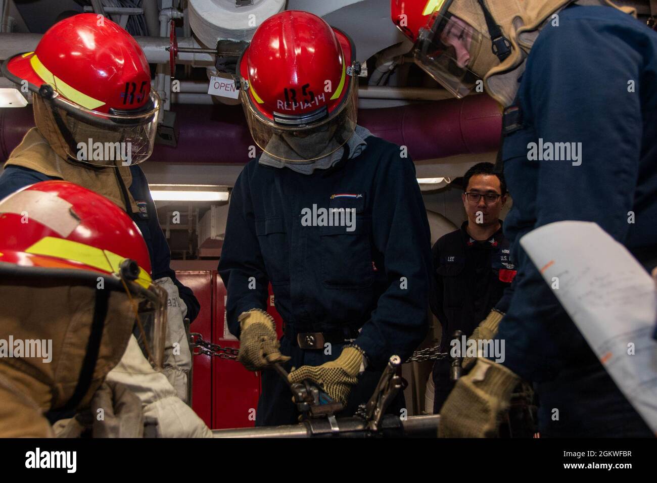 210708-N-UF592-1067 ARABIAN SEA (July 8, 2021) Sailors simulate pipe ...