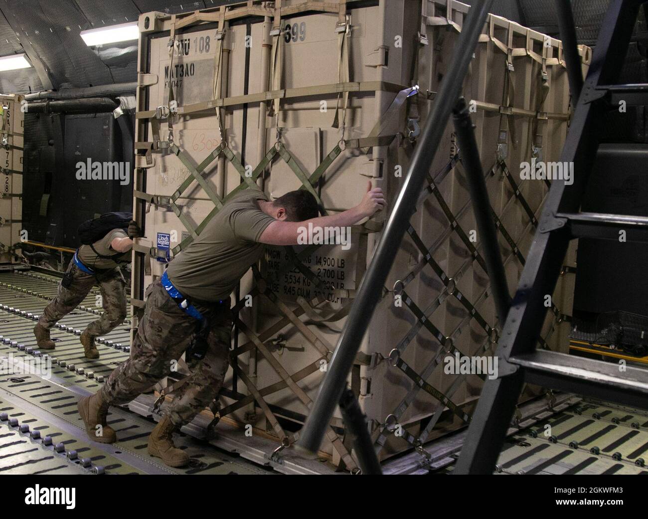 Airmen with the 60th Air Mobility Wing unload containers for Forager 21 ...