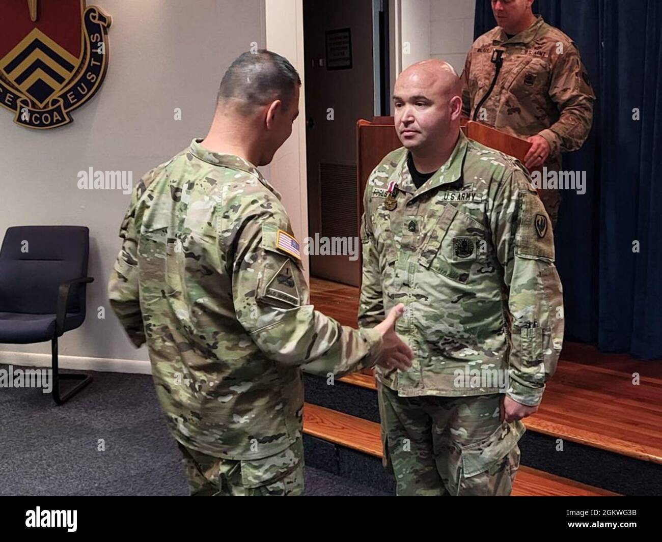 U.S. Army Sgt. 1st Class Michael Fuglsang is presented a Meritorious ...