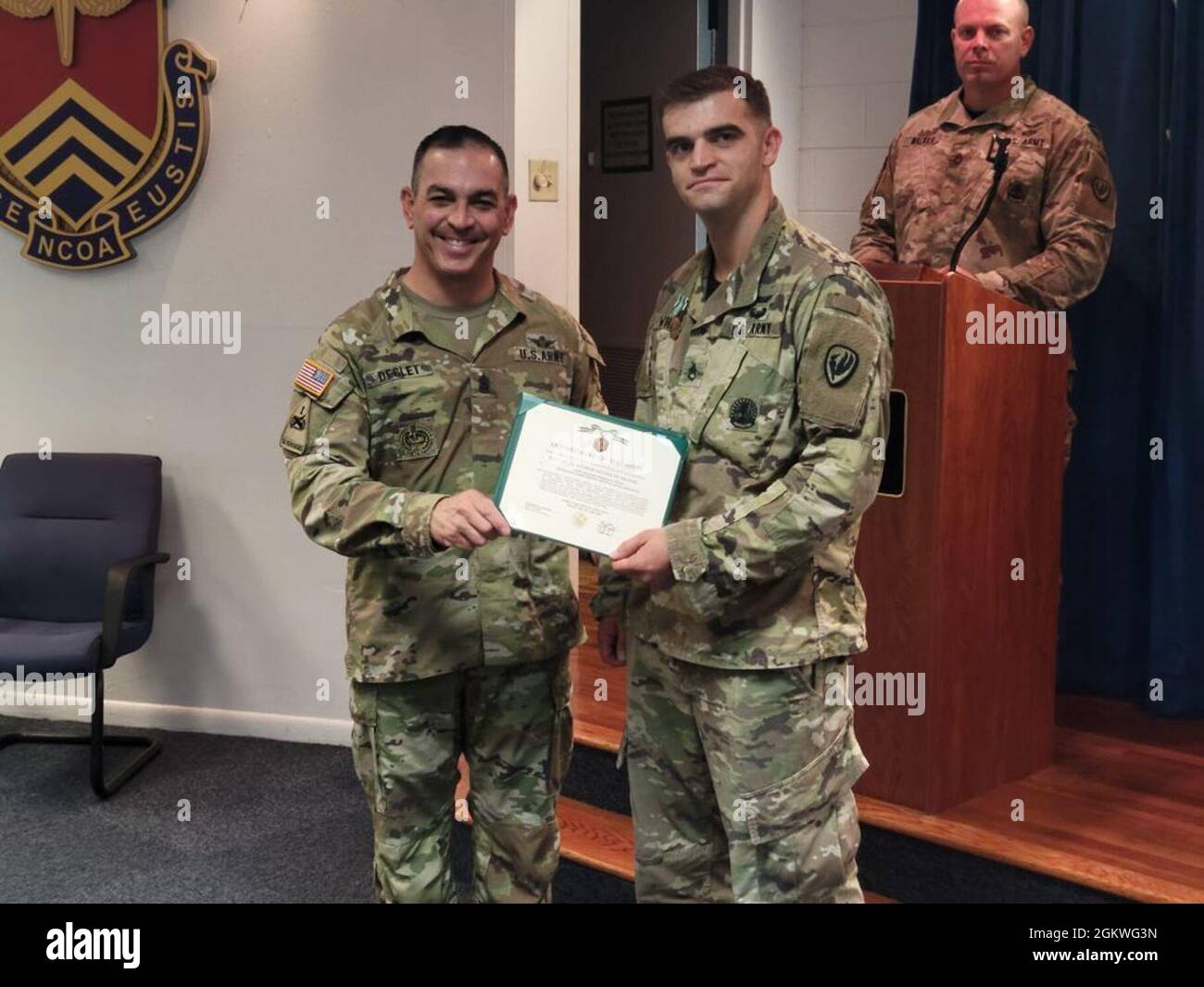 U.S. Army Staff Sgt. Brendon White is presented an Army Commendation ...