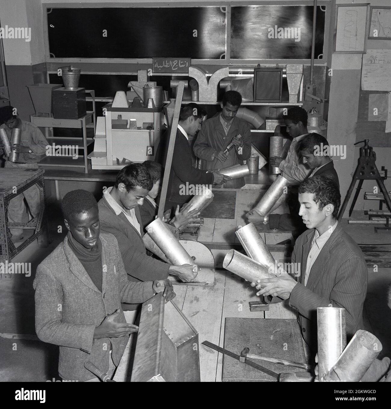 1960s, historical, a group of male apprentices in a metal work class ...