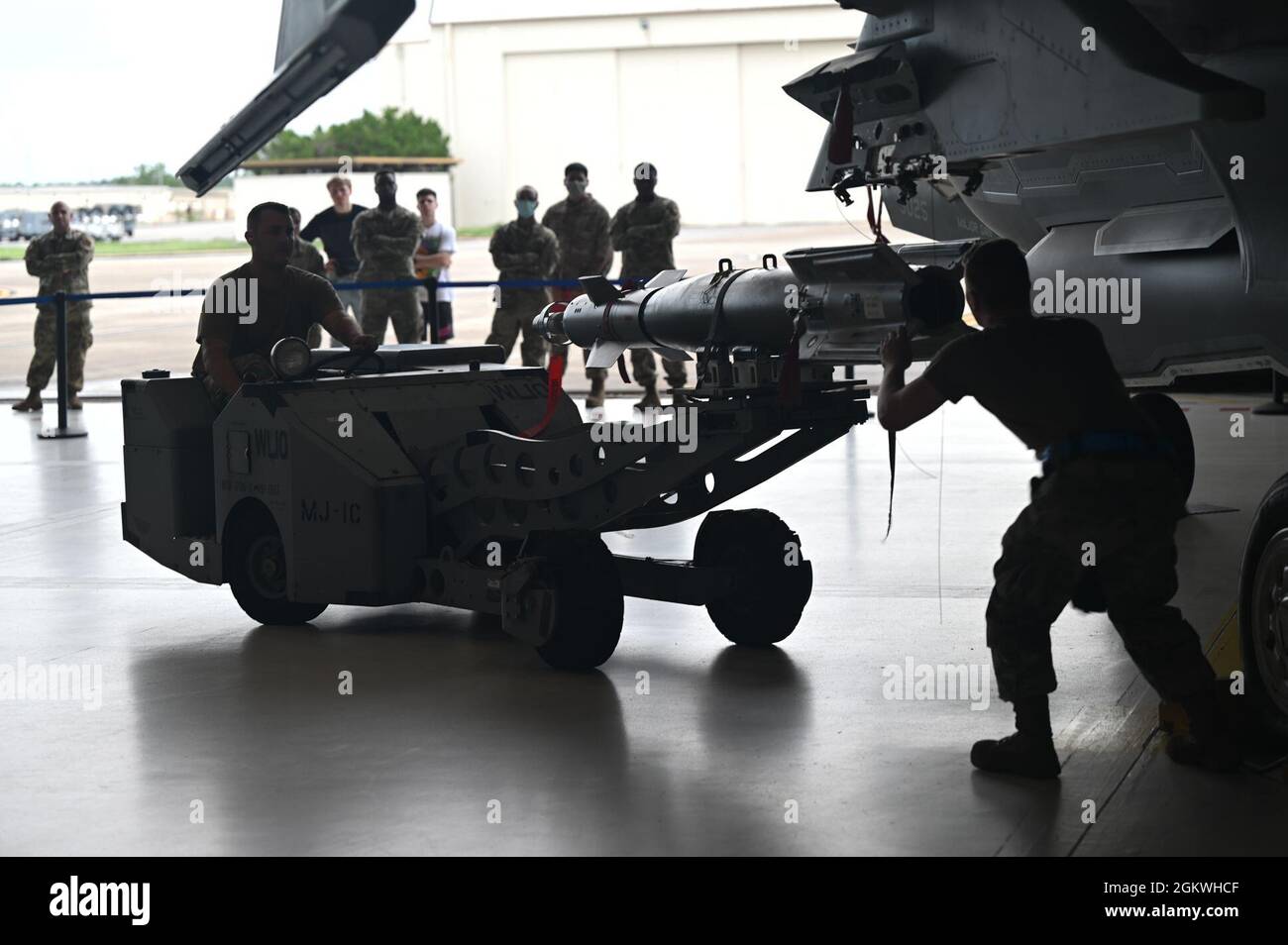 U.S. Air Force weapons load crew members from the 33rd Aircraft ...