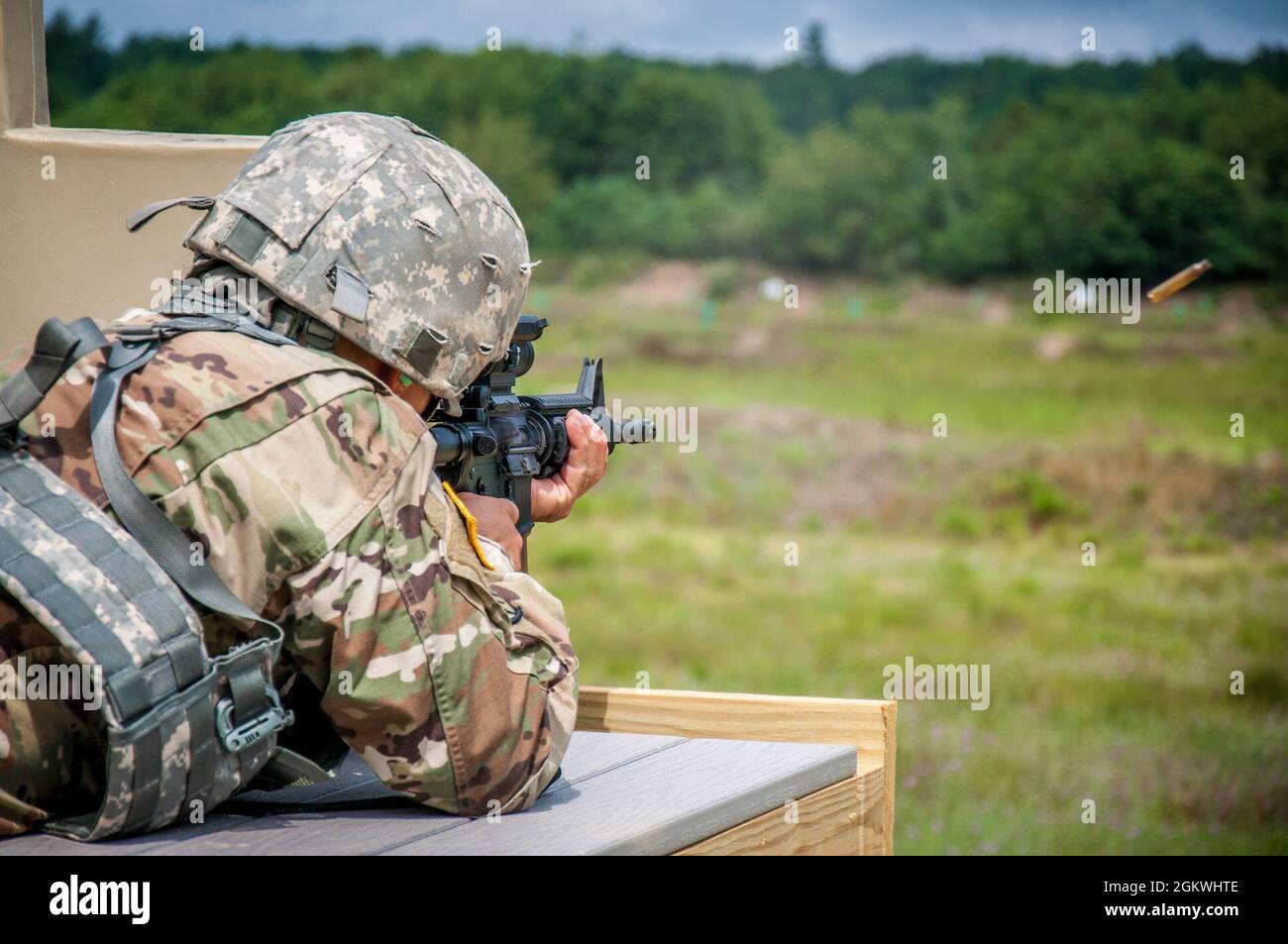 A Soldier fires from the prone unsupported position a target down range ...