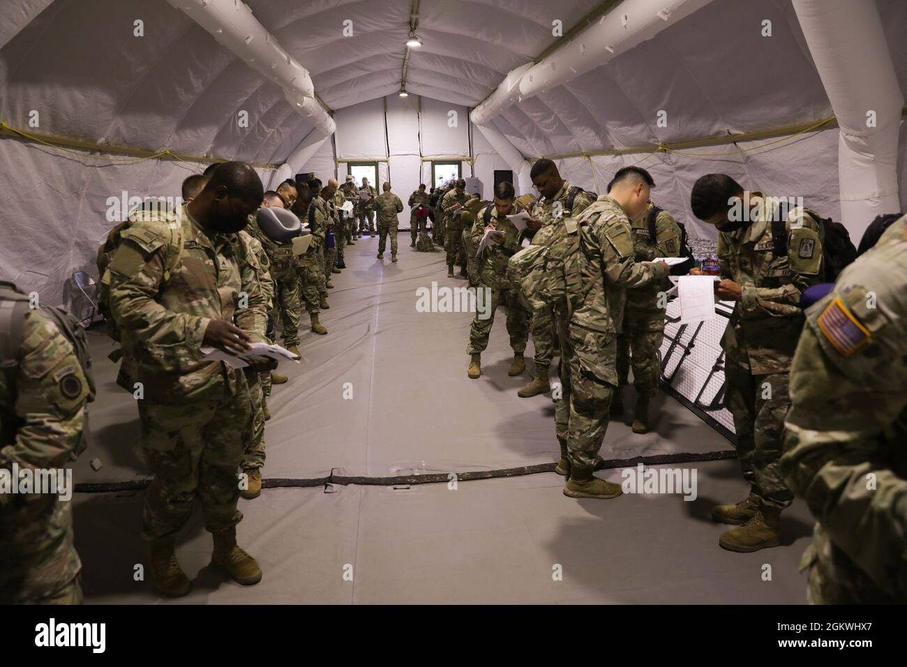 America’s First Corps Soldiers go through customs for exercise Forager ...