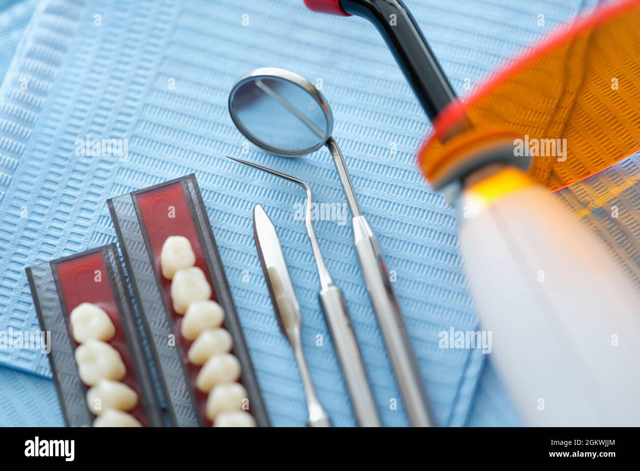 Dental instruments and dentures lying on sterile medical napkin in ...